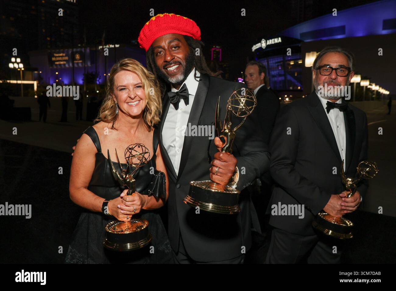 Michelle Lankwarden, from left, and Damian Marcano enjoy the 77th Emmy ...