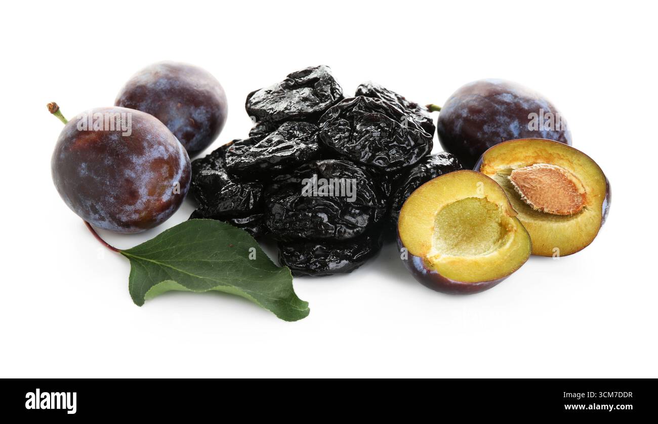 Dried prunes, fresh plums and green leaf isolated on white Stock Photo ...