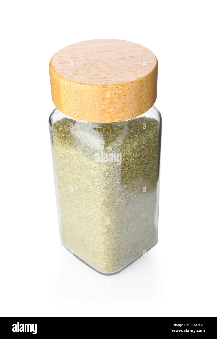 Dried basil powder in glass jar isolated on white. Aromatic spice Stock ...