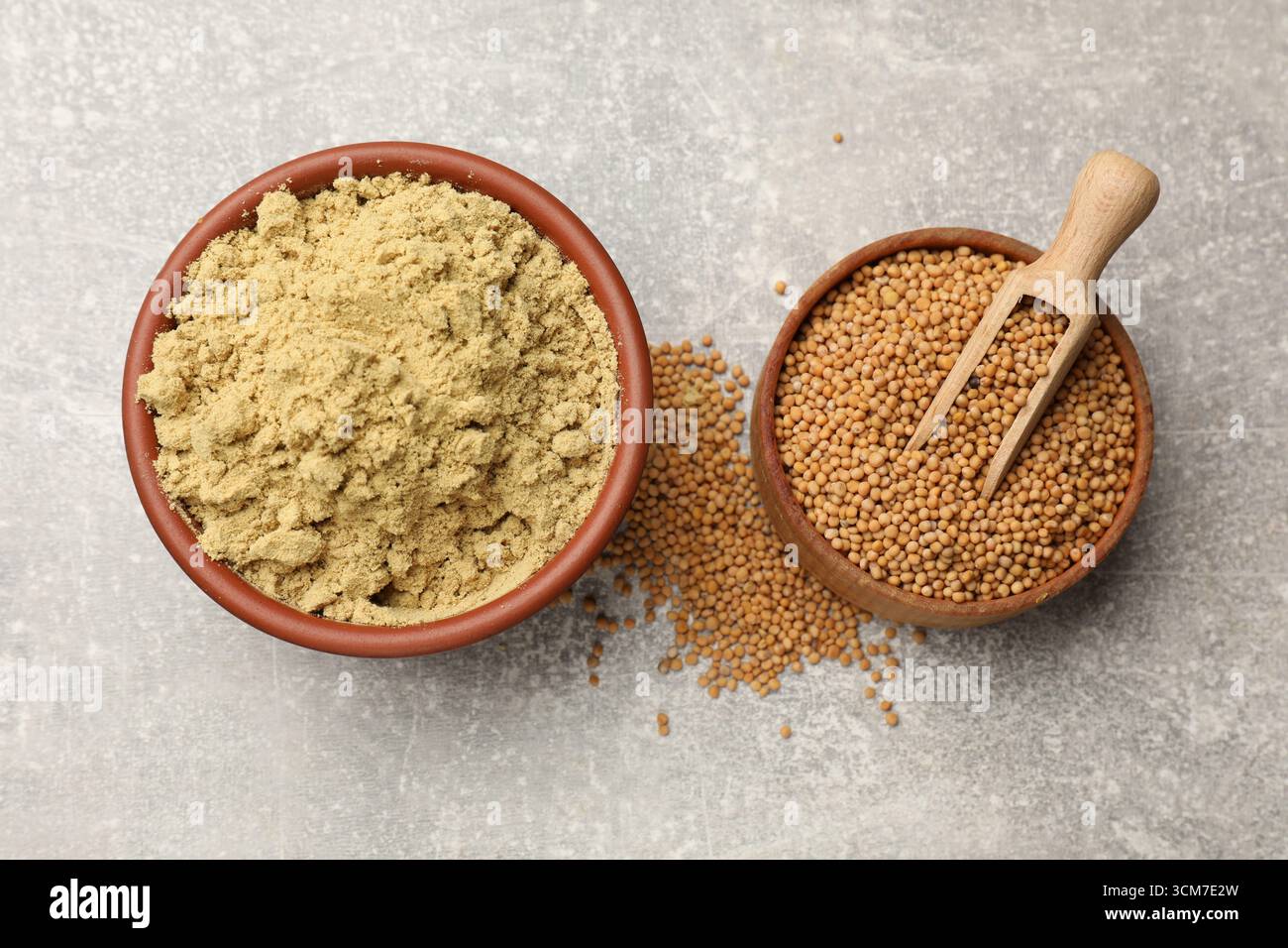Different types of mustard on light grey table, flat lay Stock Photo ...