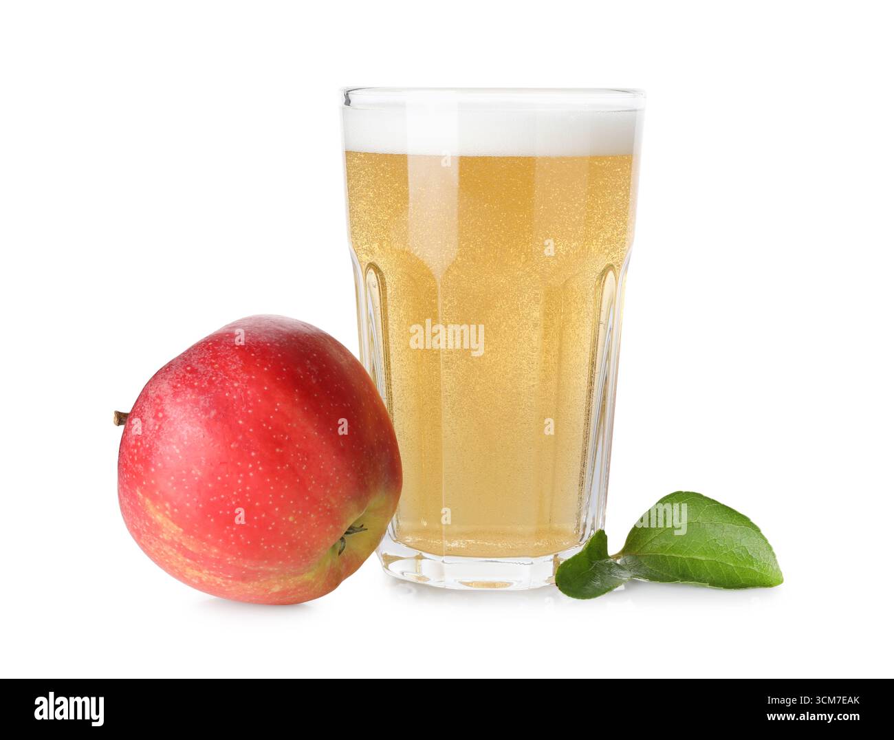 Tasty cider in glass, fresh apple and green leaves isolated on white ...