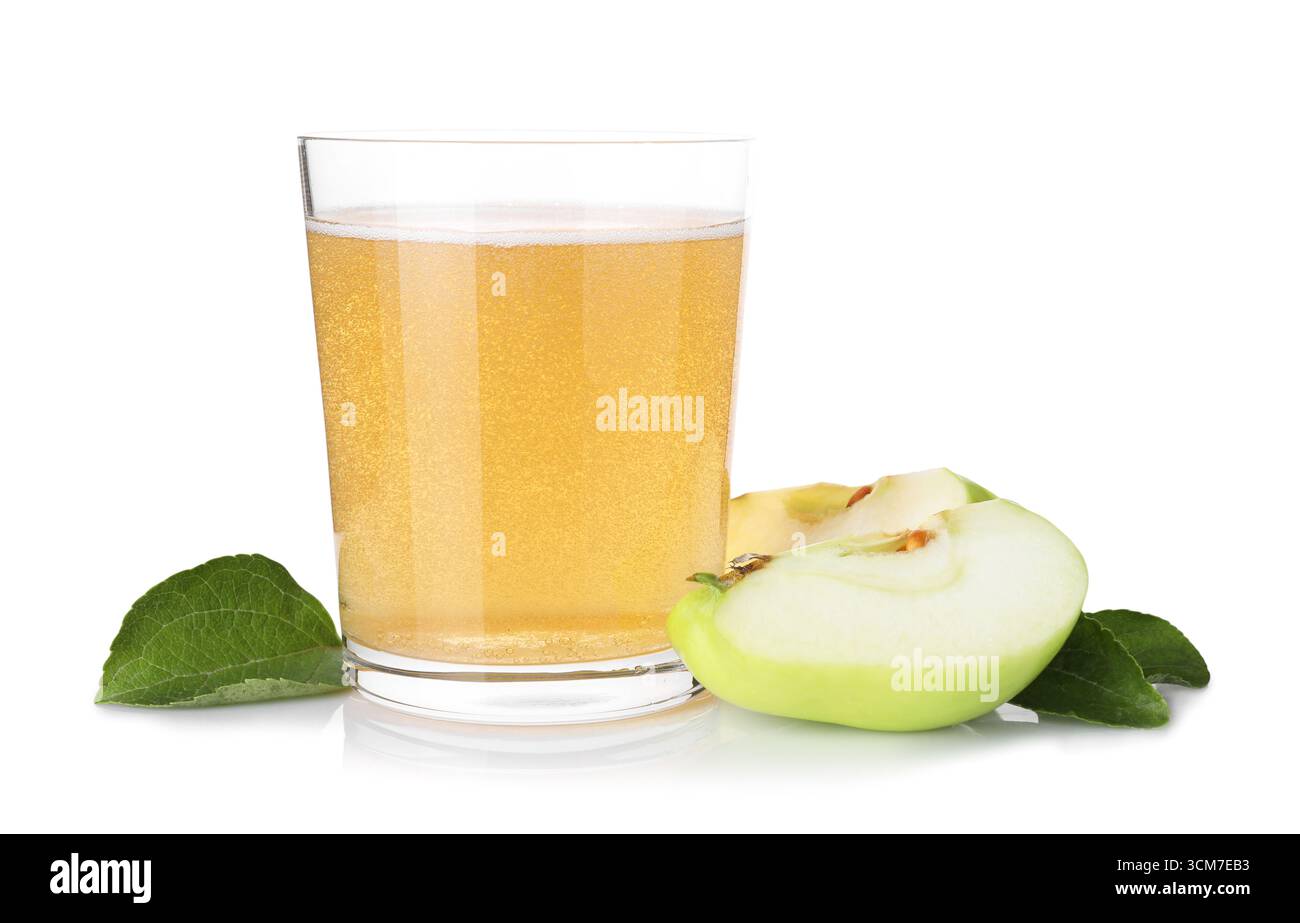Tasty cider in glass, cut fresh apple and green leaves isolated on ...
