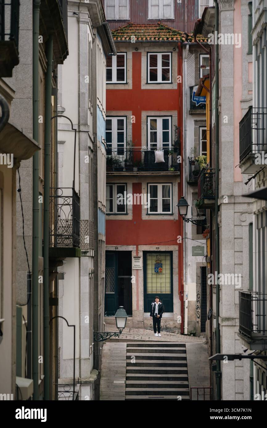 Person Climbing Stone Steps To Colorful Portuguese Building In Porto ...