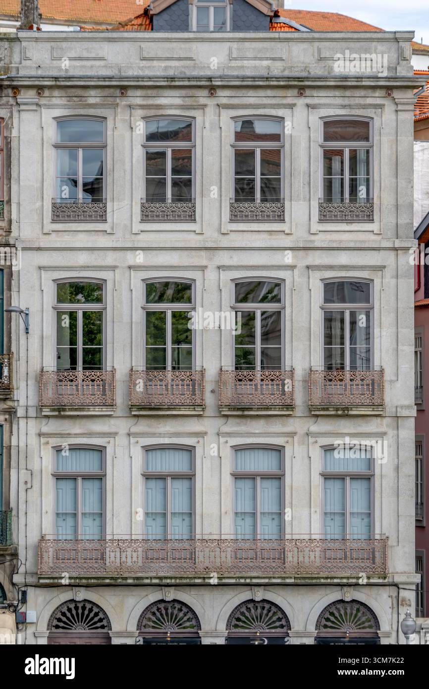 Historic Portuguese Building Facade With Ornate Iron Balconies And ...
