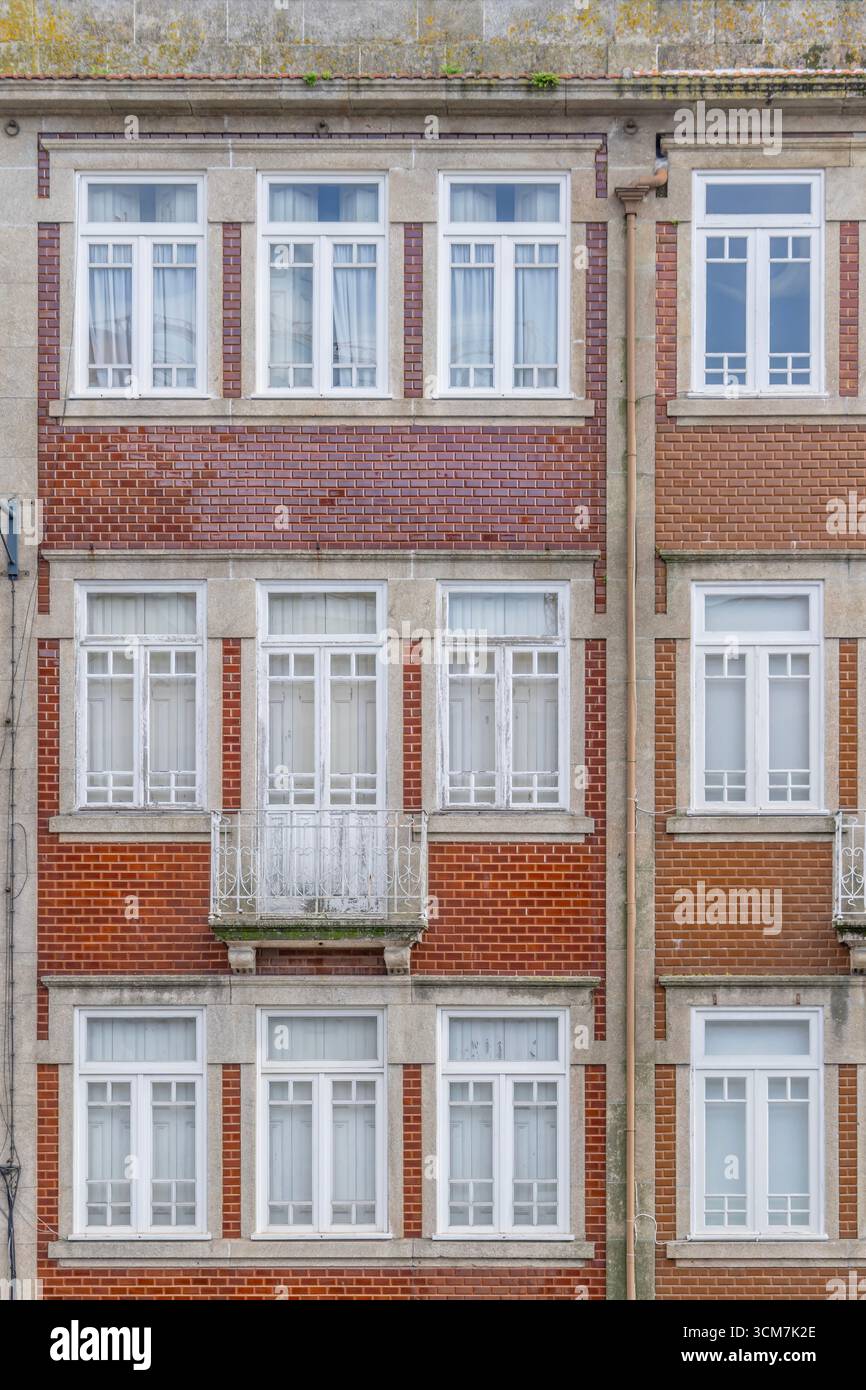 Red Brick Portuguese Building With White French Windows And Stone ...