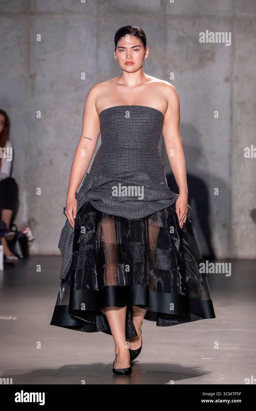 A model walks the runway for the Bach Mai fashion show during the ...