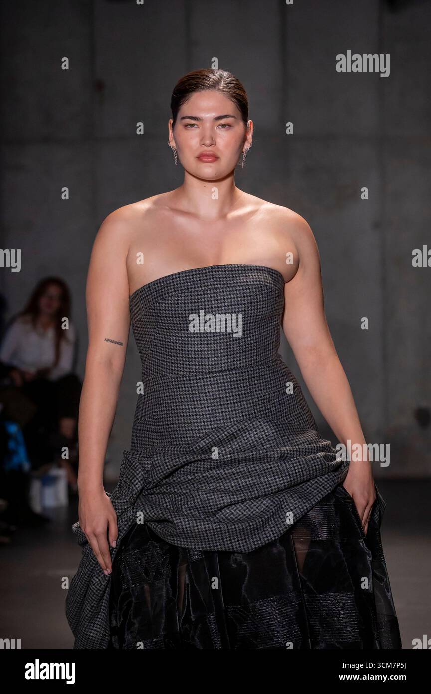 A model walks the runway for the Bach Mai fashion show during the ...