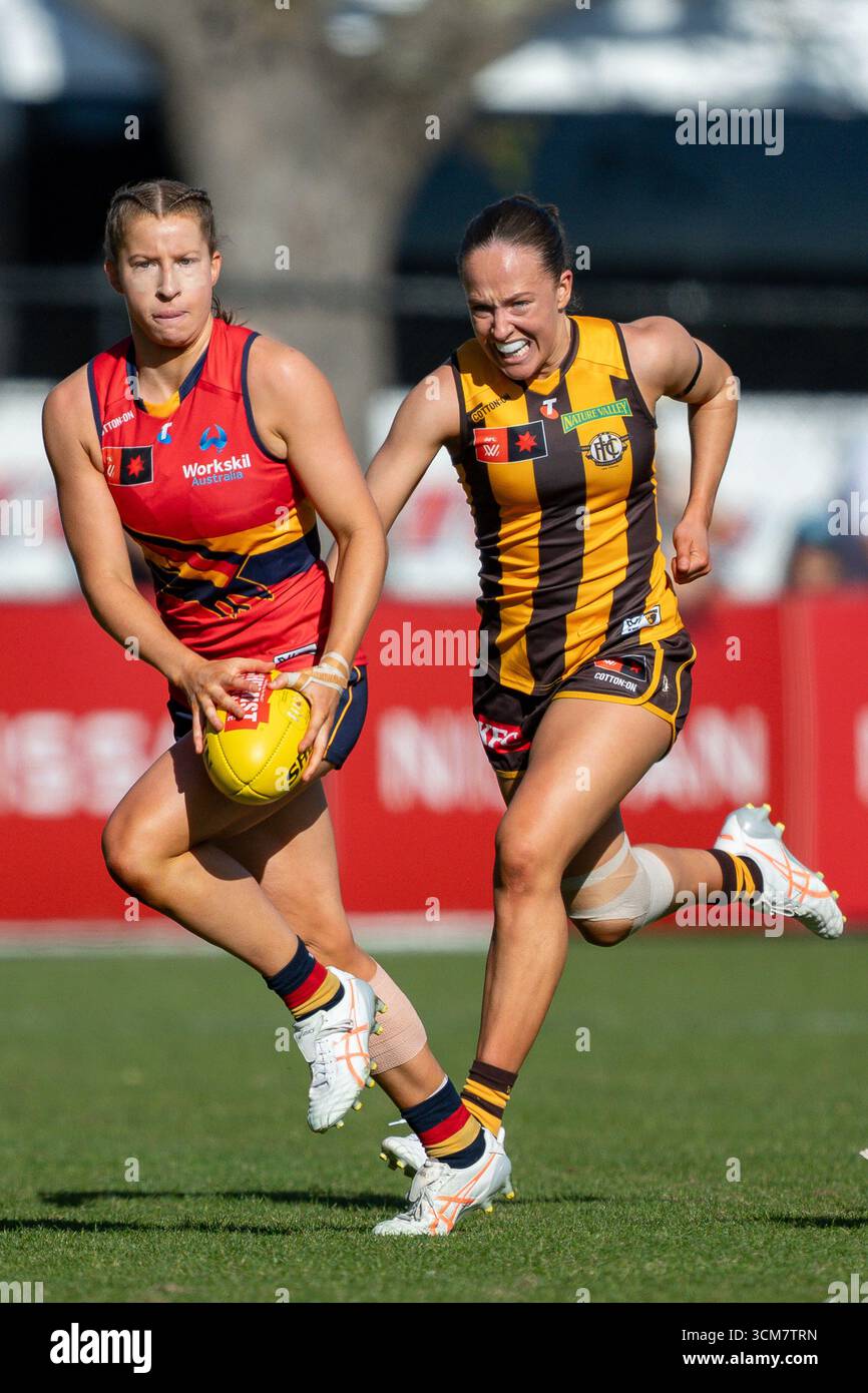 Sarah Goodwin of Crows (L) and Jasmine Fleming of Hawks (R) seen in ...