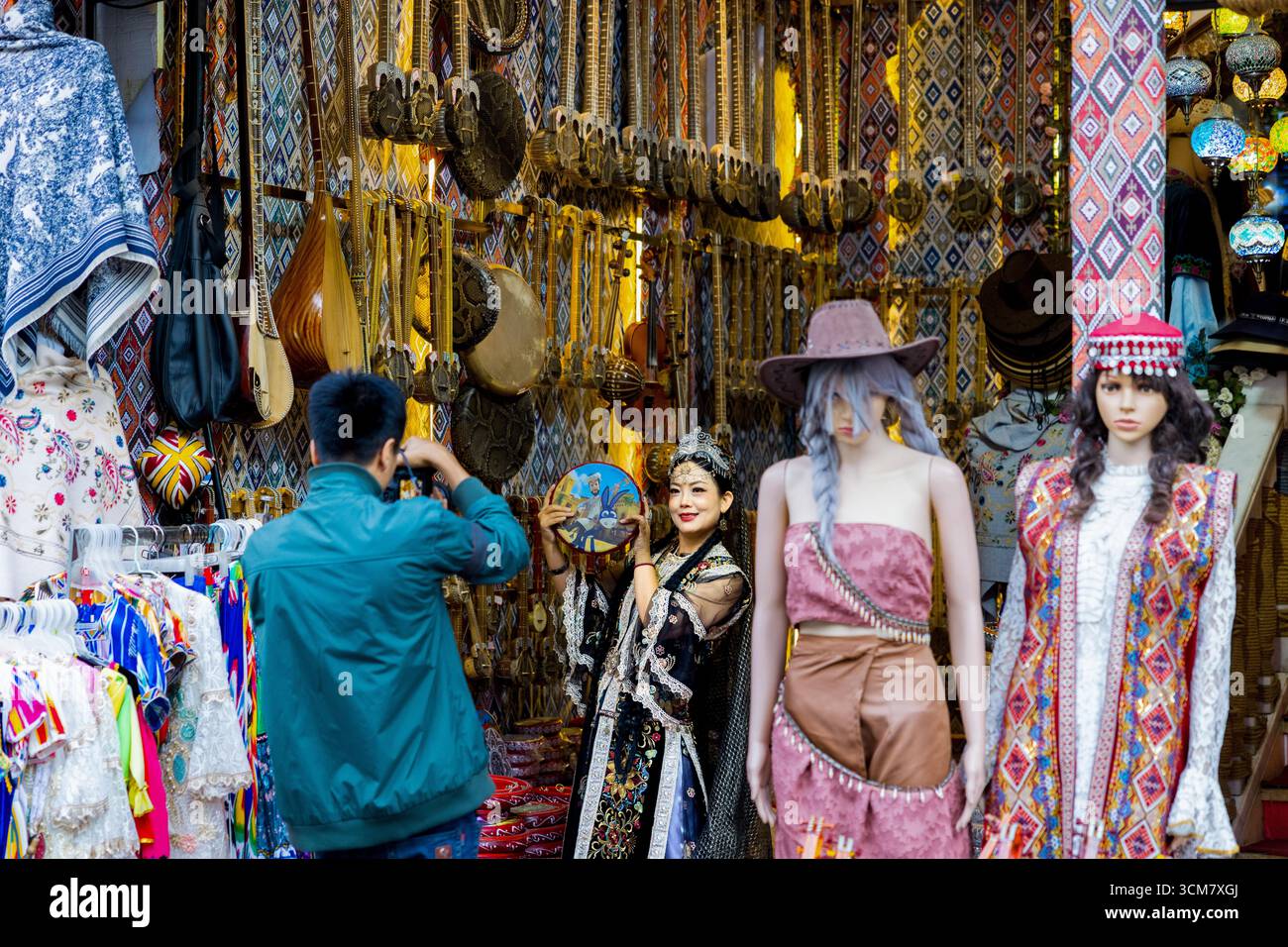 Tourists visit the Grand Bazaar in Urumqi City, northwest China's ...