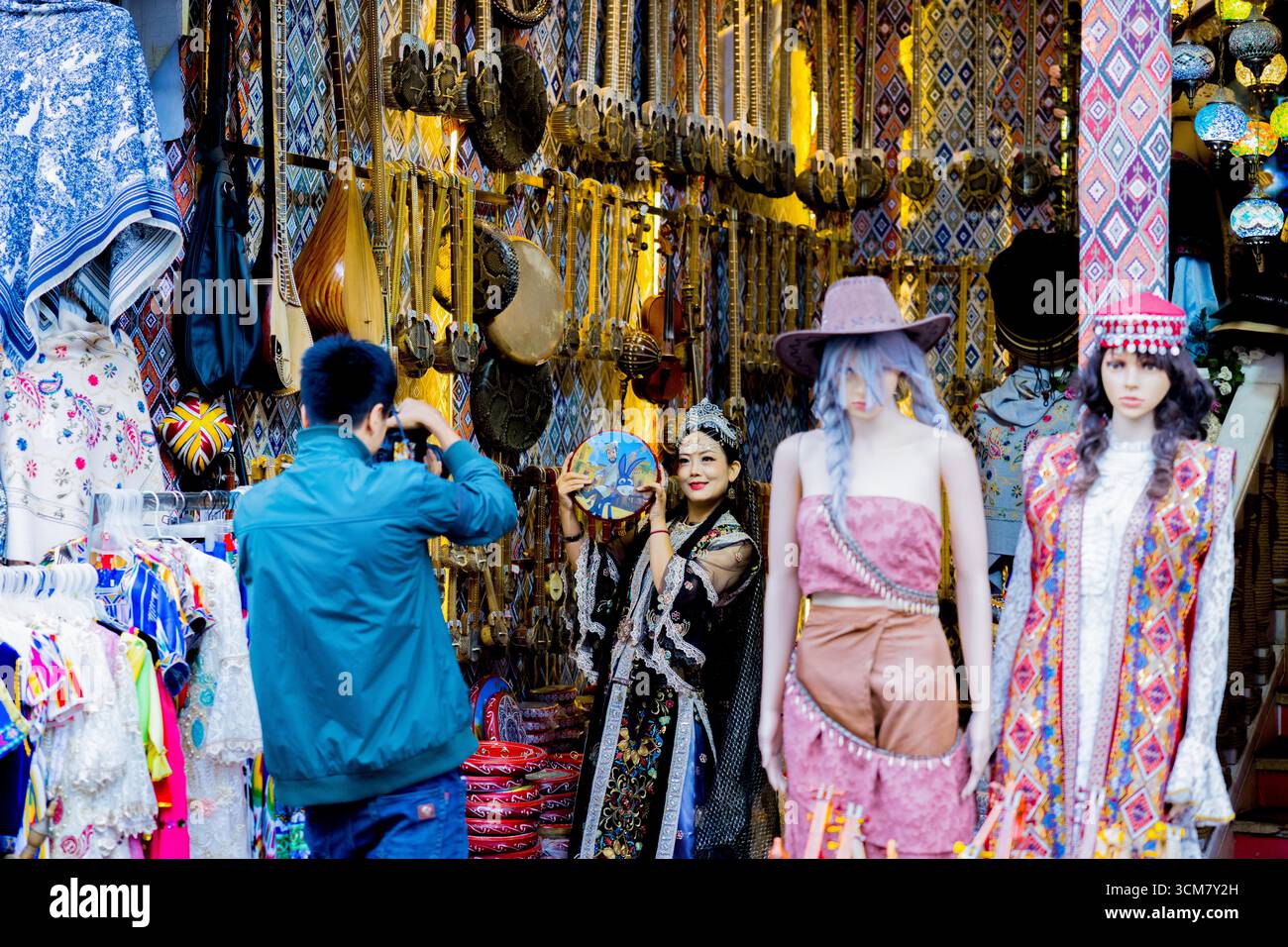Tourists visit the Grand Bazaar in Urumqi City, northwest China's ...