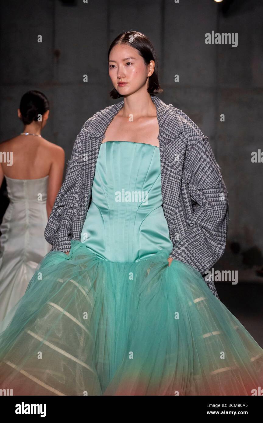 A model walks the runway for the Bach Mai fashion show during the ...