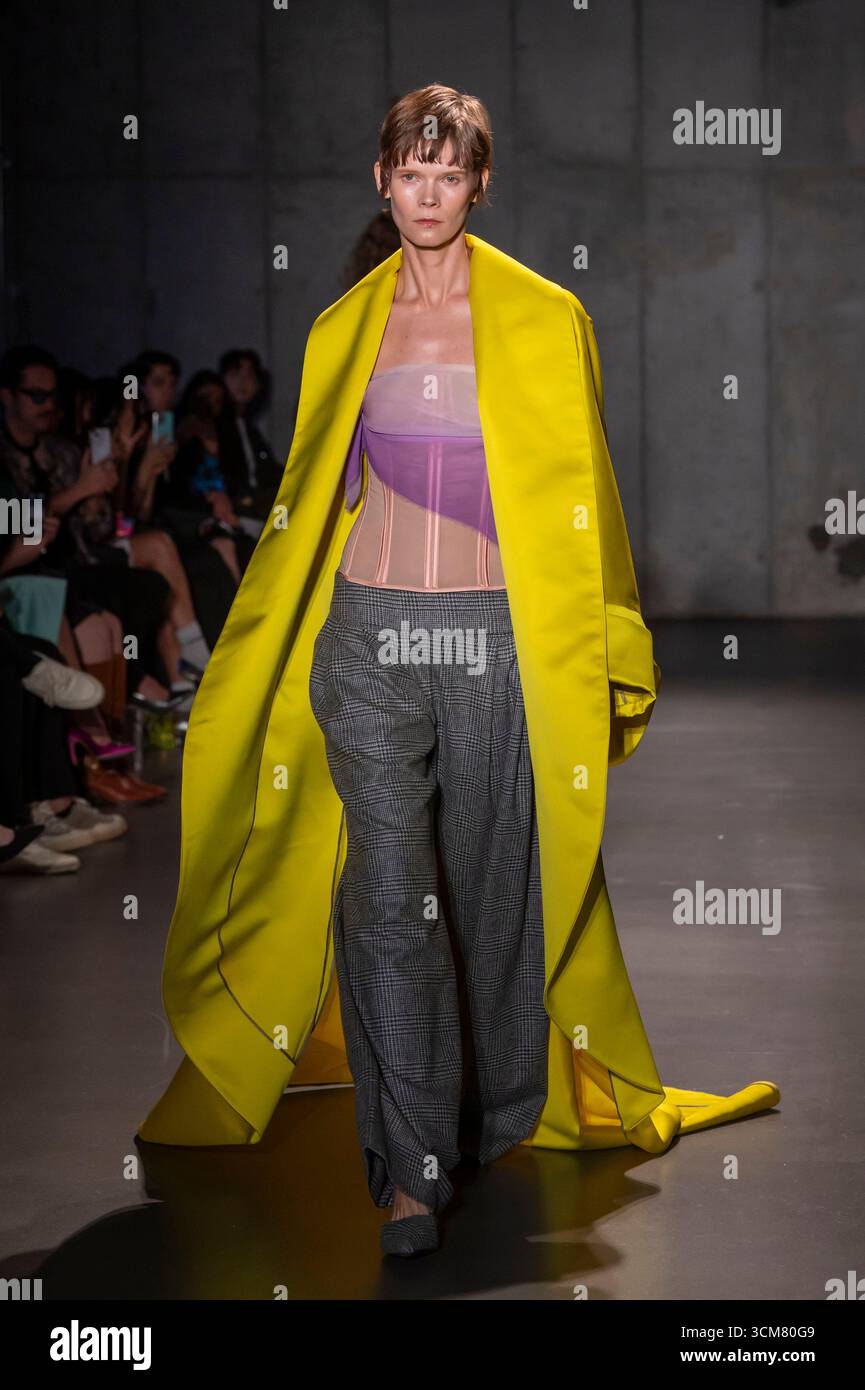 A model walks the runway for the Bach Mai fashion show during the ...