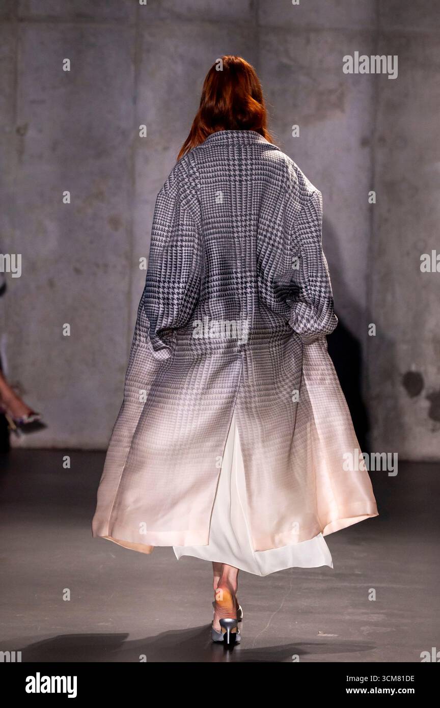 A model walks the runway for the Bach Mai fashion show during the ...