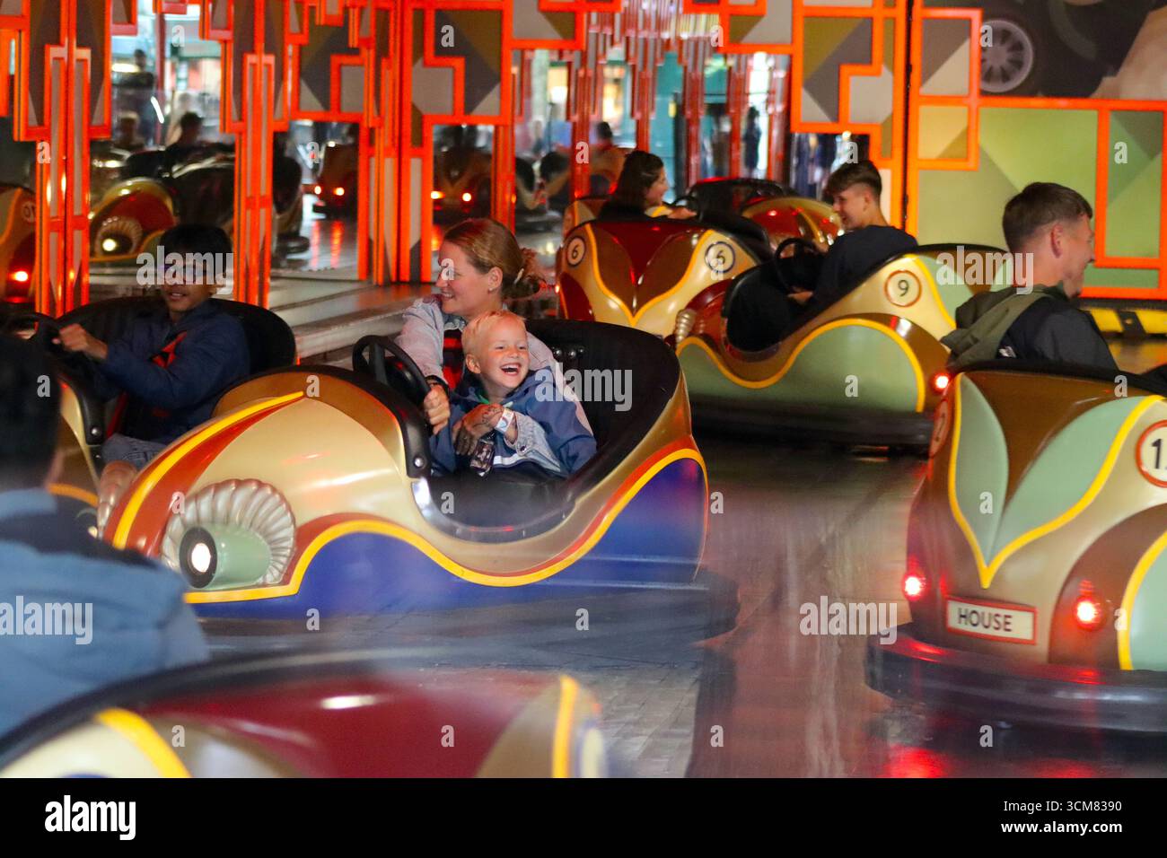 The thrill and excitement of bumper cars or dodgems, a popular ride at ...