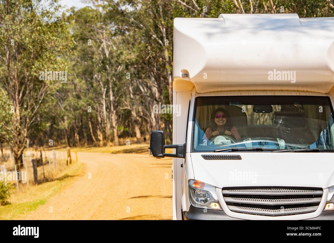 Woman driving her camper van (RV) on dirt road in New South Wales Stock ...