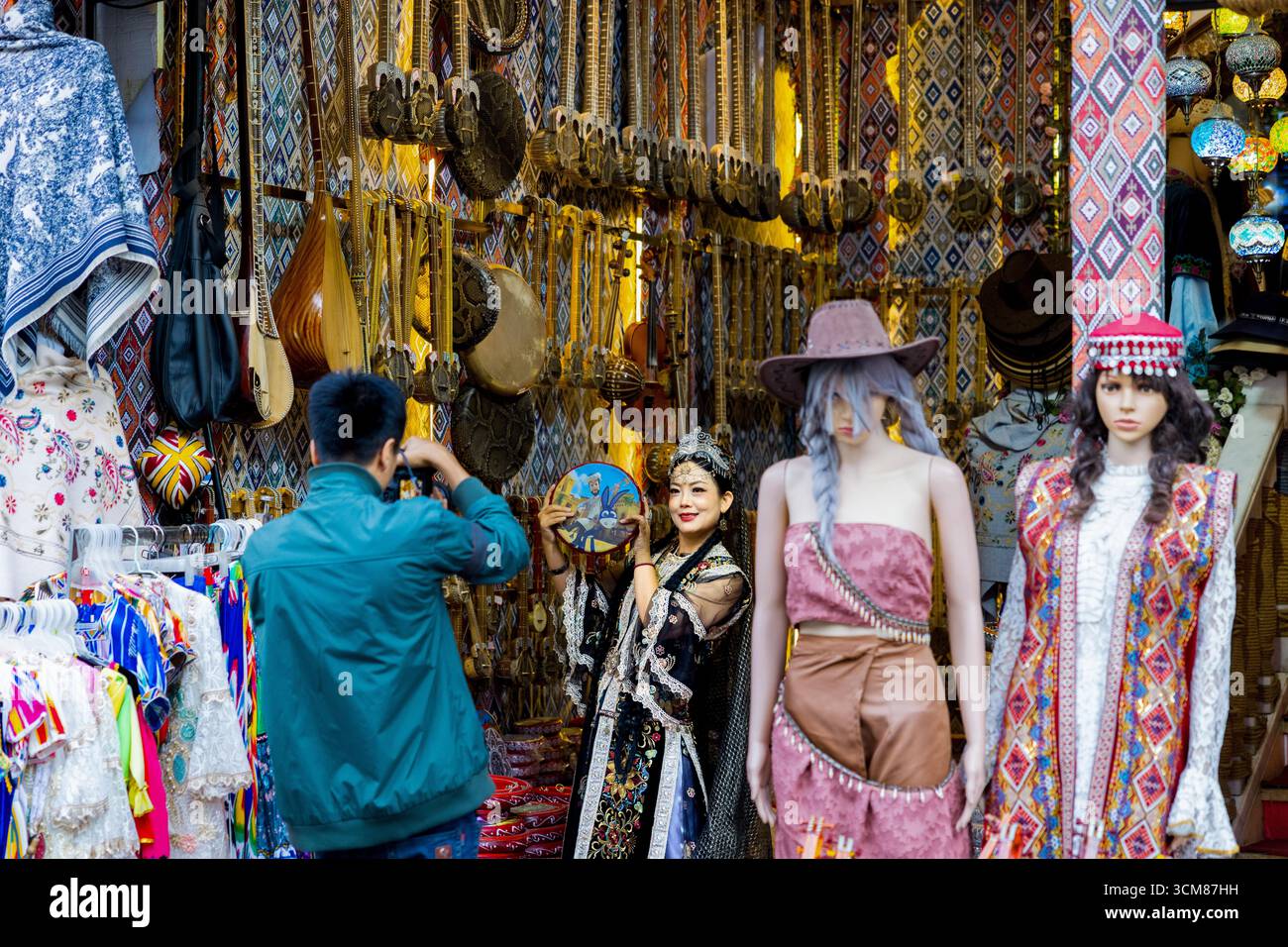 Tourists visit the Grand Bazaar in Urumqi City, northwest China's ...