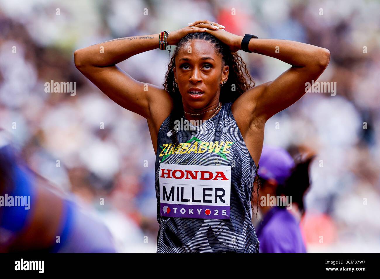 Ashley Miller of Zimbabwe looks exhausted after competing in the Women ...