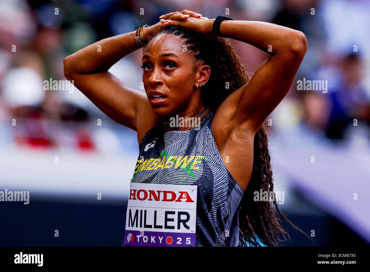 Ashley Miller of Zimbabwe looks exhausted after competing in the Women ...