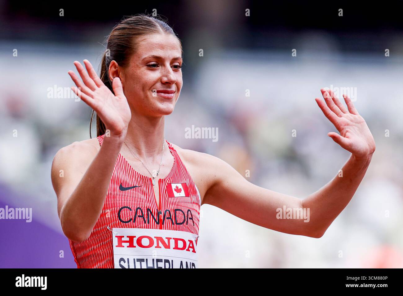 Savannah Sutherland of Canada wave before competing in the Women's 400 ...