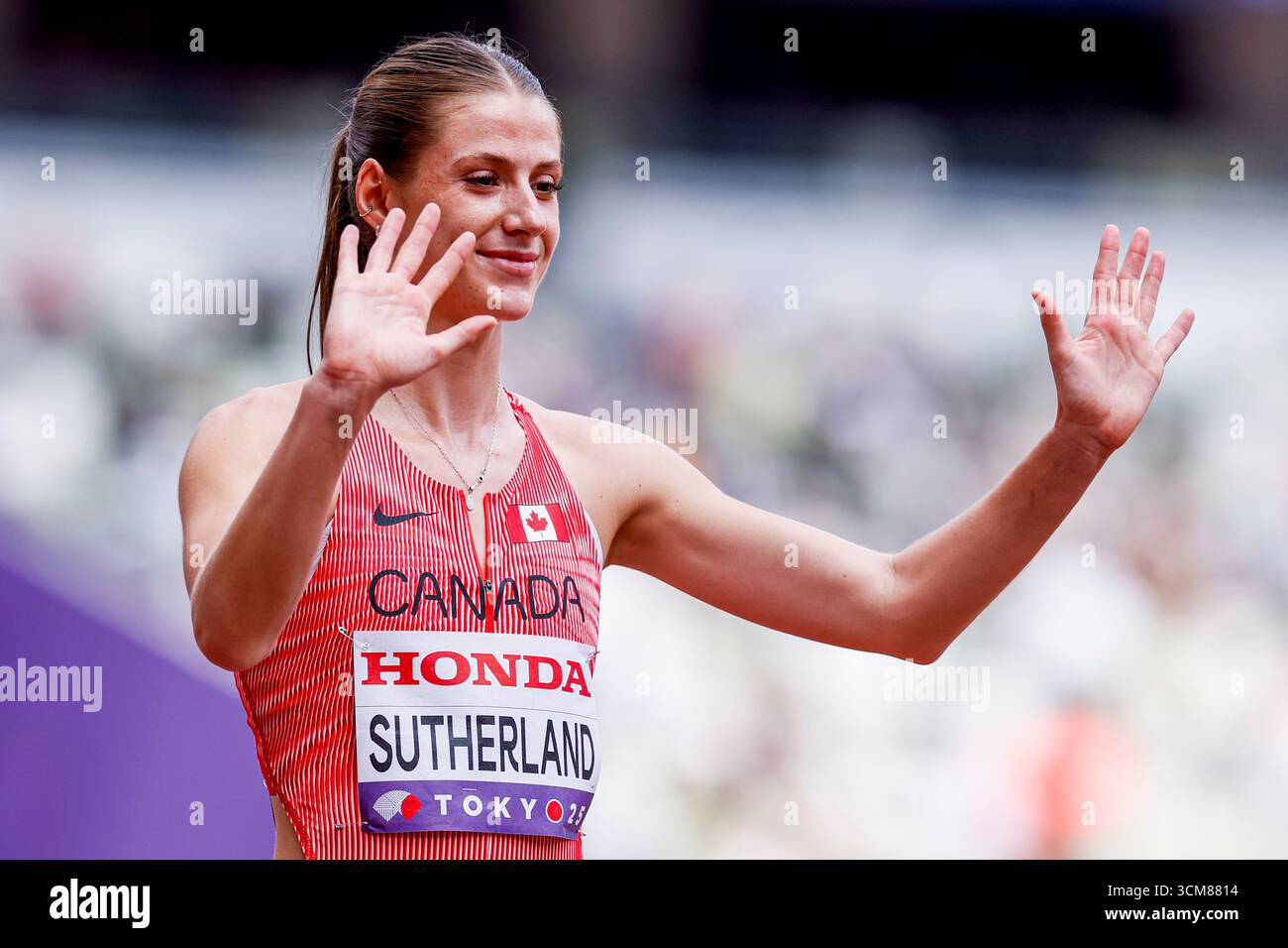 Savannah Sutherland of Canada wave before competing in the Women's 400 ...