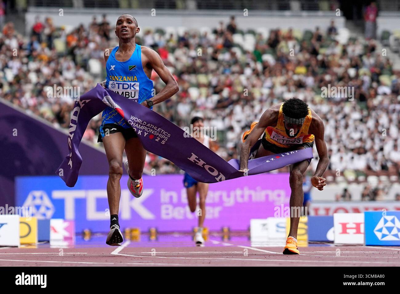 Tanzania's Alphonce Felix Simbu, left, wins the gold in the men's ...
