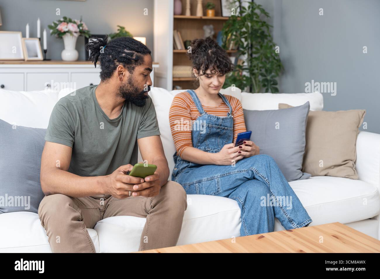 Jealousy and frustration. Young man is insecure, suffering from ...