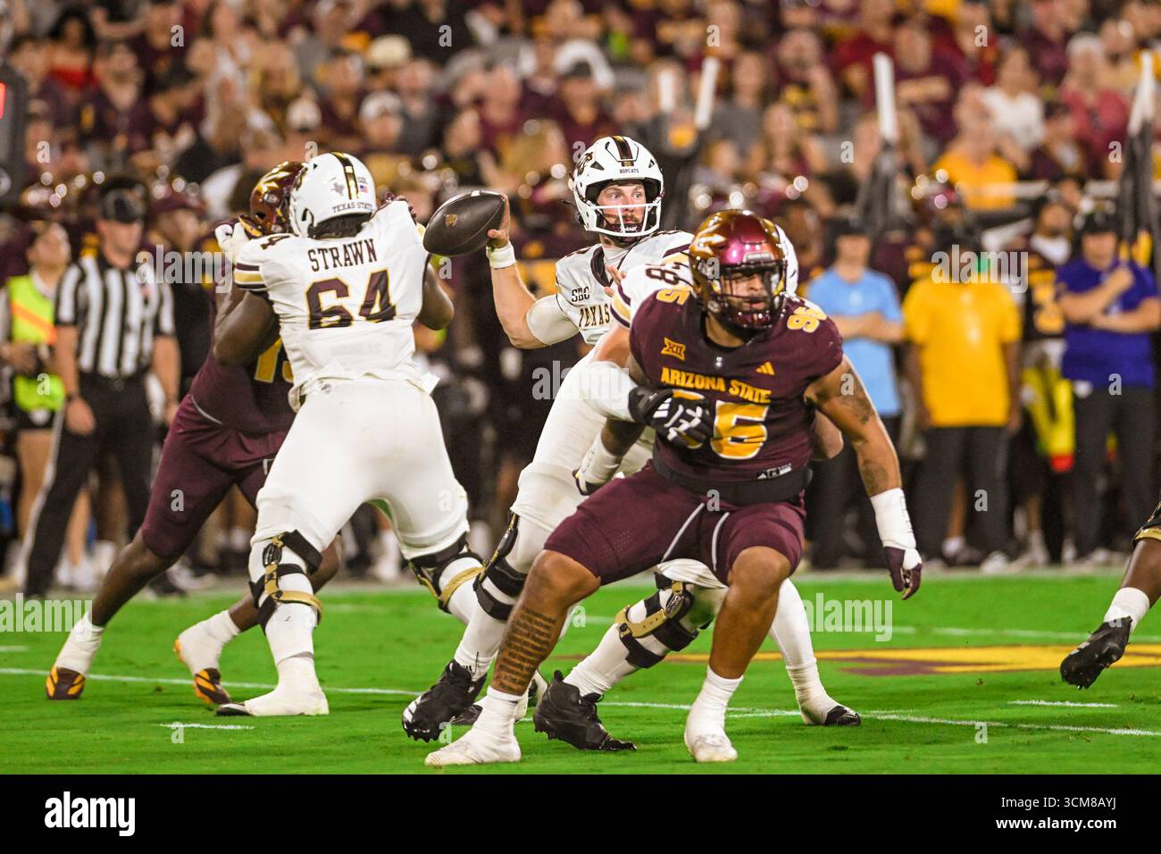 Texas State Bobcats quarterback Brad Jackson (8) looks down field in ...