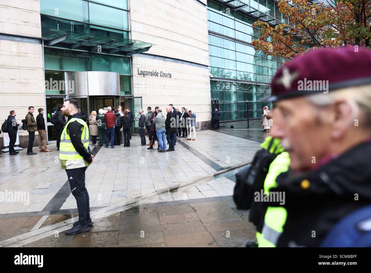 People stand outside of Belfast Crown Court, where the trial of a ...