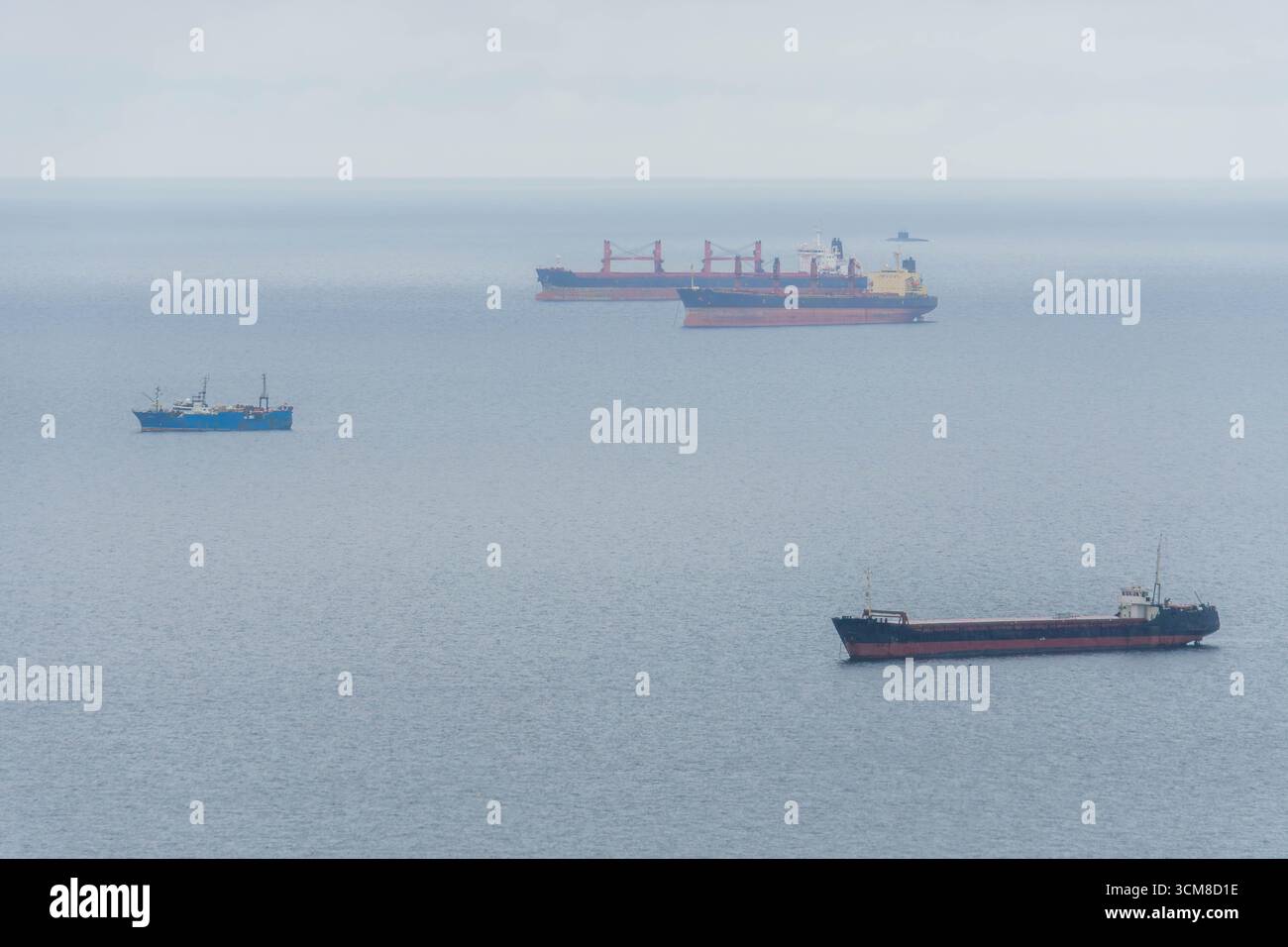 Cargo and fishing ships anchored in Ussuri Bay, Vladivostok, Russia, in ...