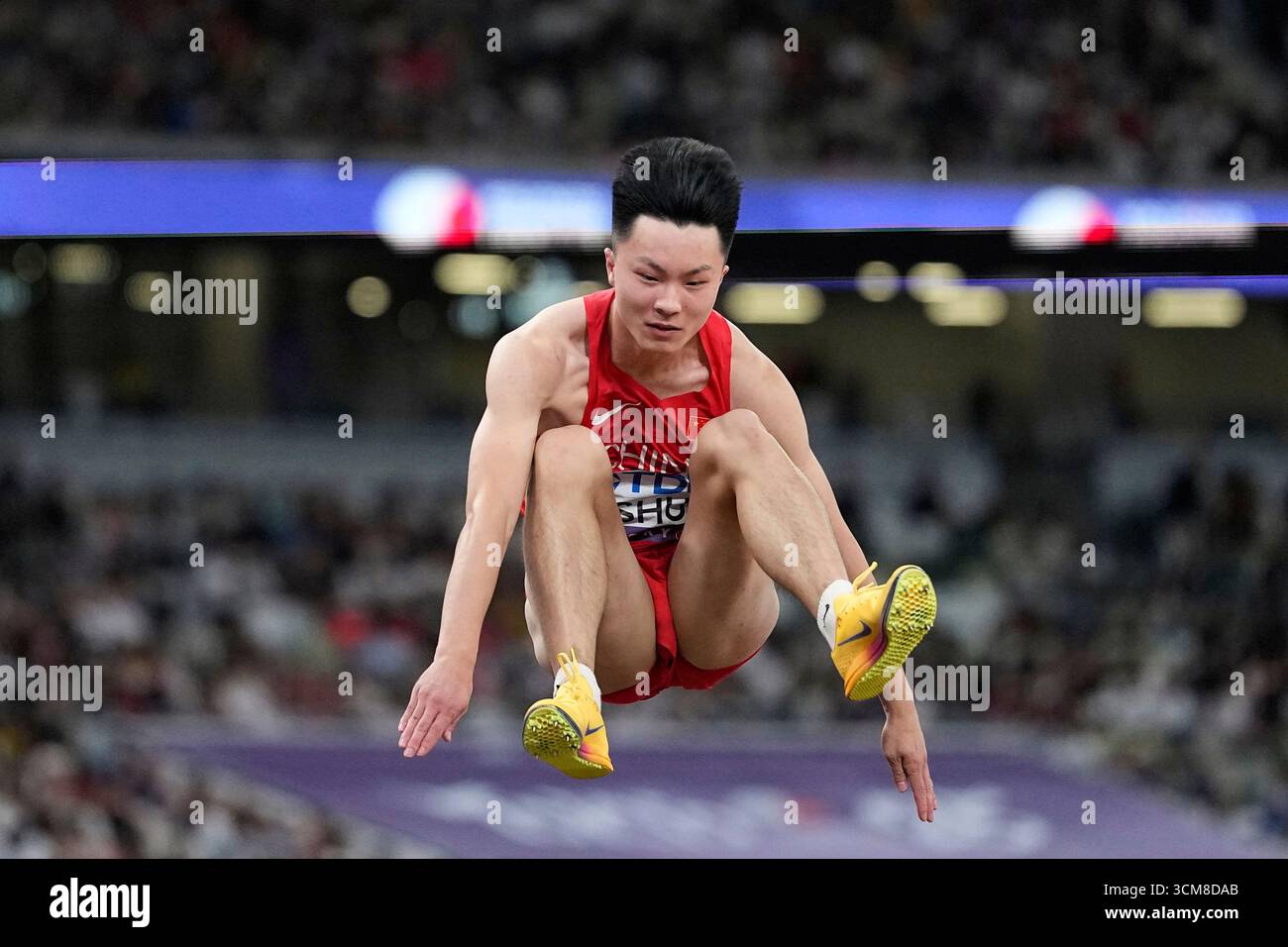 China's Shu Heng makes an attempt in the men's long jump qualification ...
