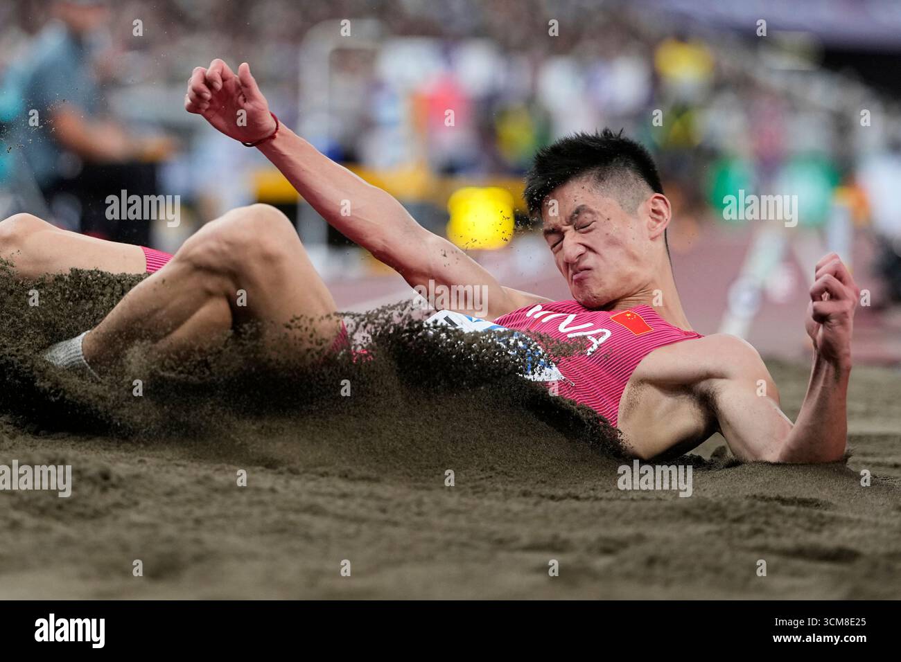 China's Zhang Mingkun competes in the men's long jump qualification at ...