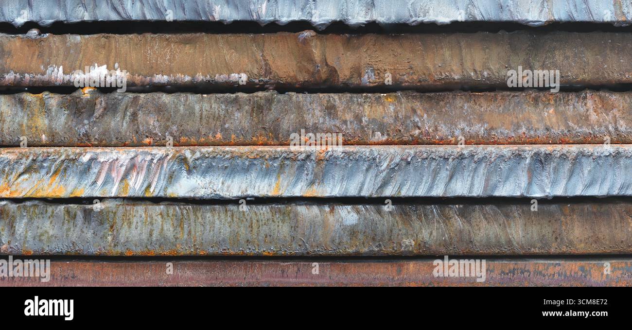 Stack of thick heavy metal plates rusty uneven surface after laser ...