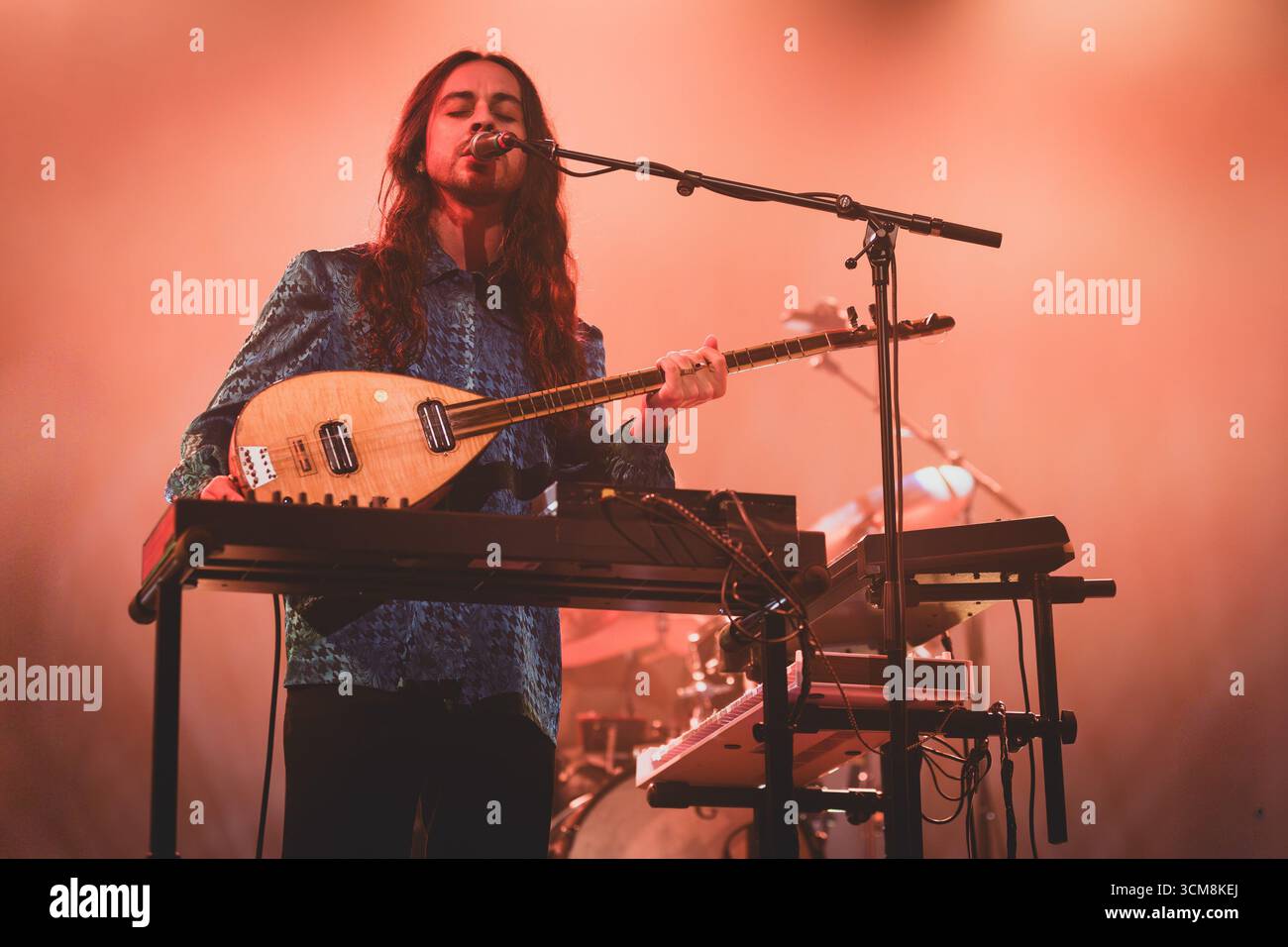 Erdinc Ecevit Yildiz, member of the band Altin Gun, performs on stage ...