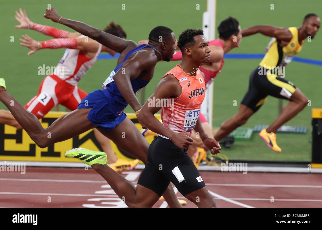 Rachid MURATAKE of Japan (front) passs a finish line in the men's 110 ...
