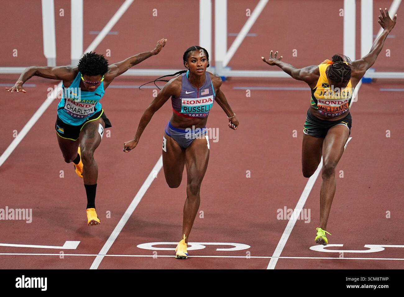 United States' Masai Russell crosses the finish line as she competes ...
