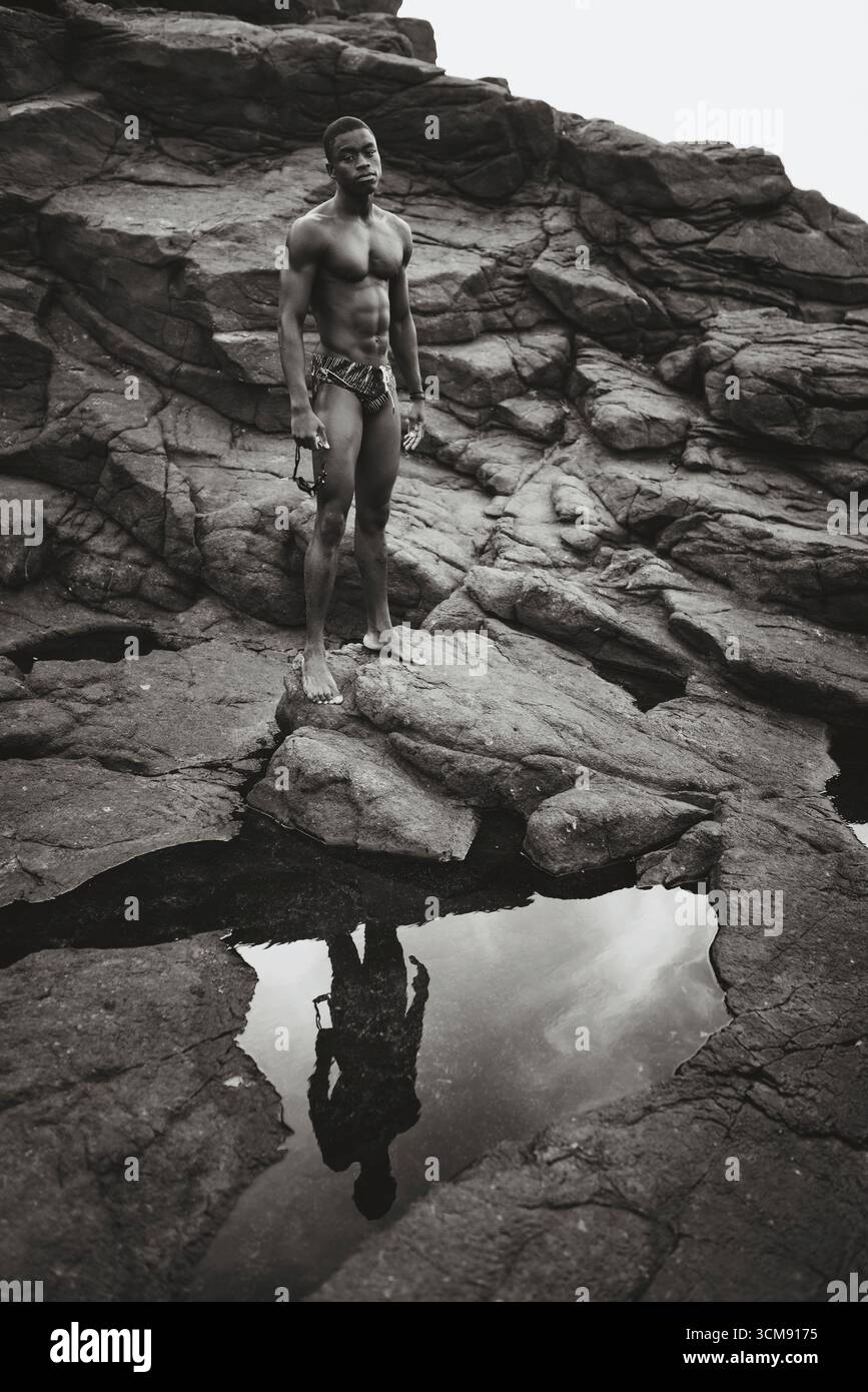 Young man on the coast of the small Cape Verde island of Santiago in ...