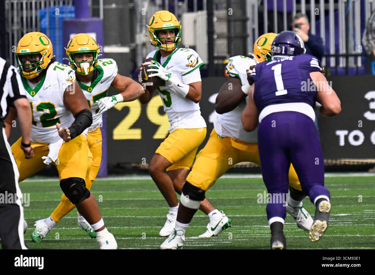 Oregon quarterback Dante Moore (5) looks to pass against Northwestern ...