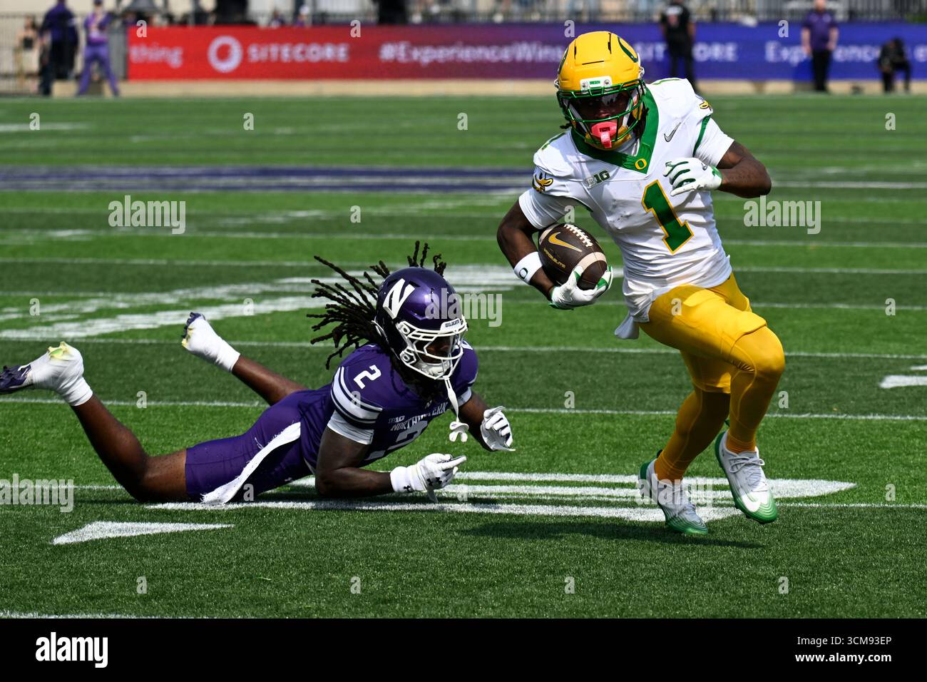 Oregon wide receiver Dakorien Moore (1) runs against Northwestern ...