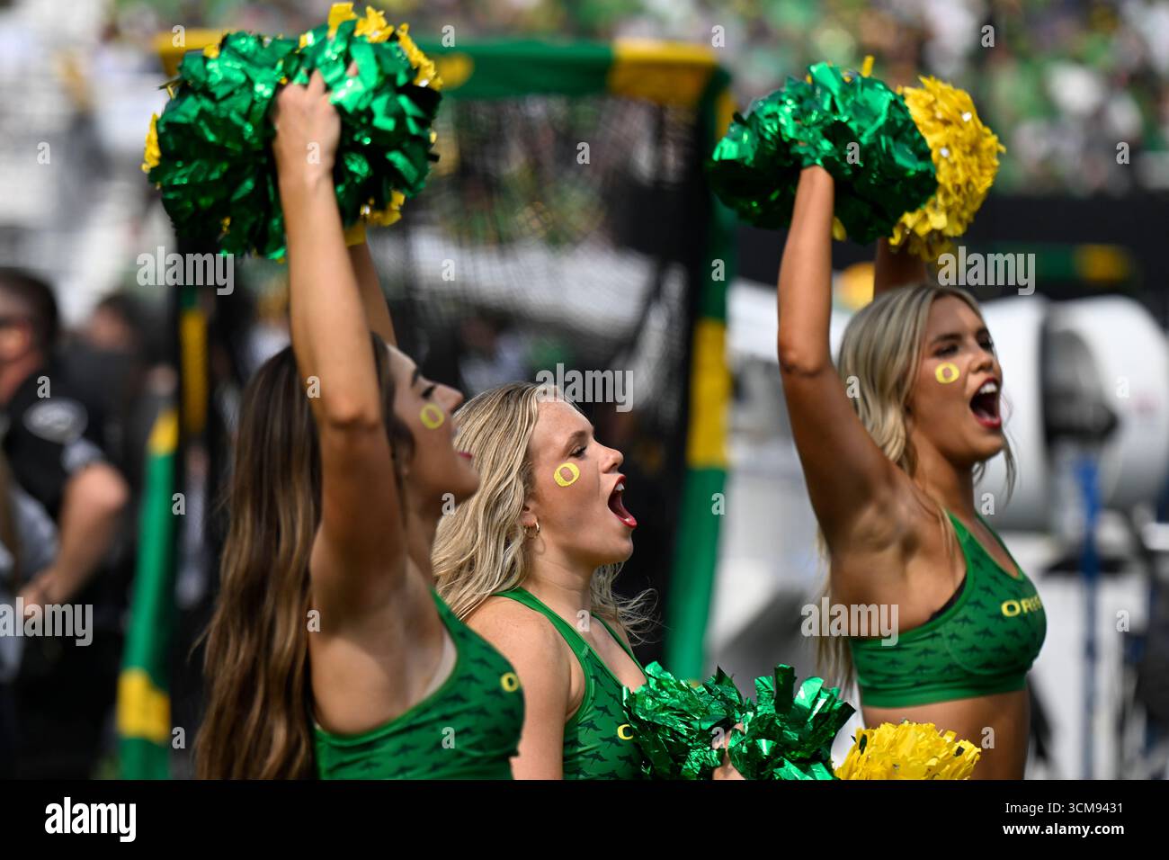 Oregon cheerleaders are seen during the second half of an NCAA college ...