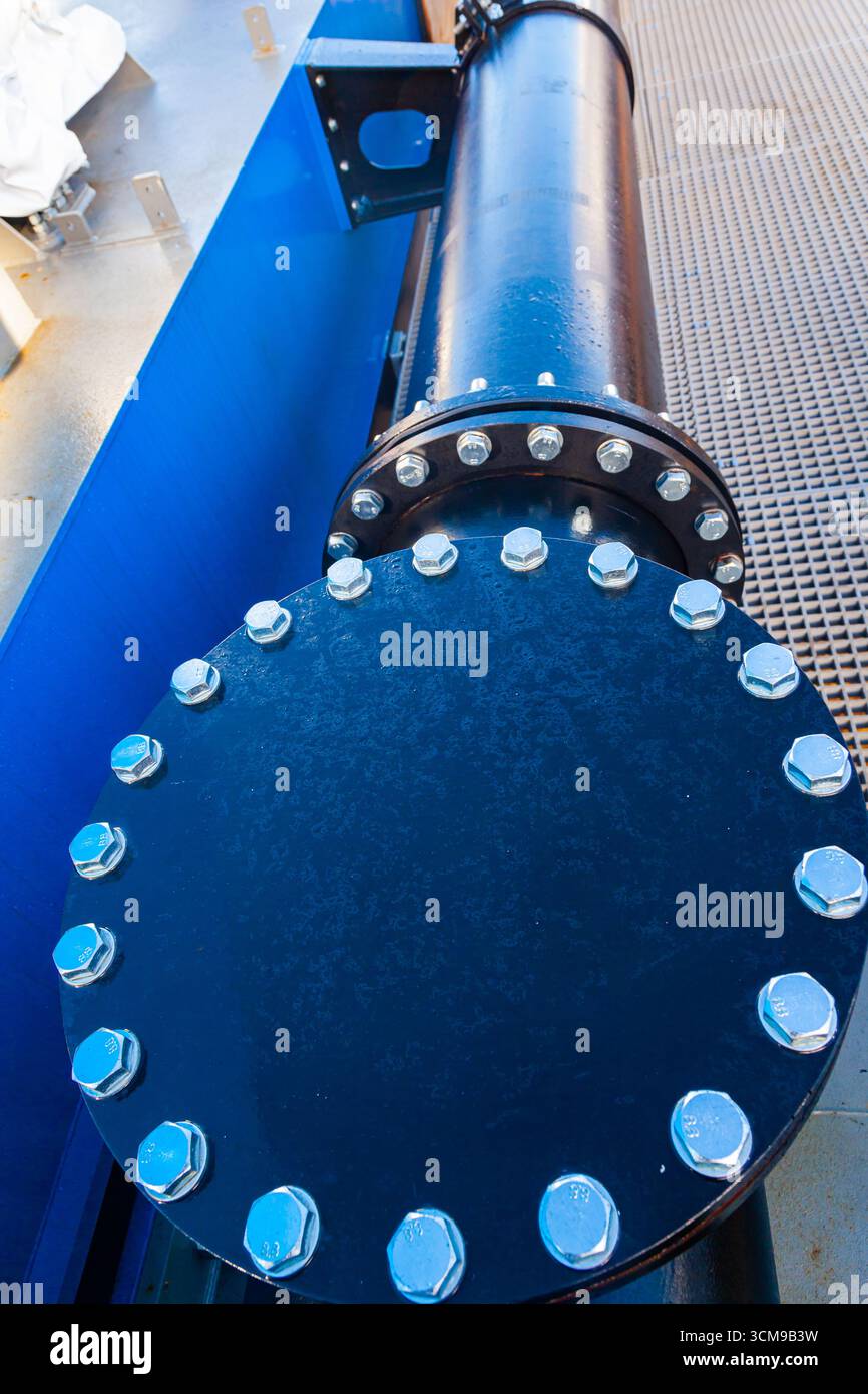 Large pipe connection with a large number of bolts and nuts enclosed on ...