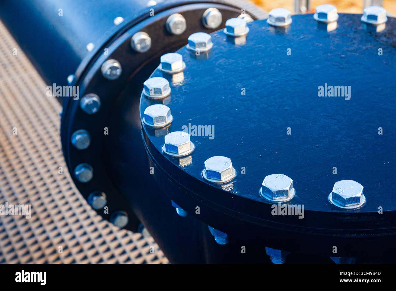 Large pipe connection with a large number of bolts and nuts enclosed on ...