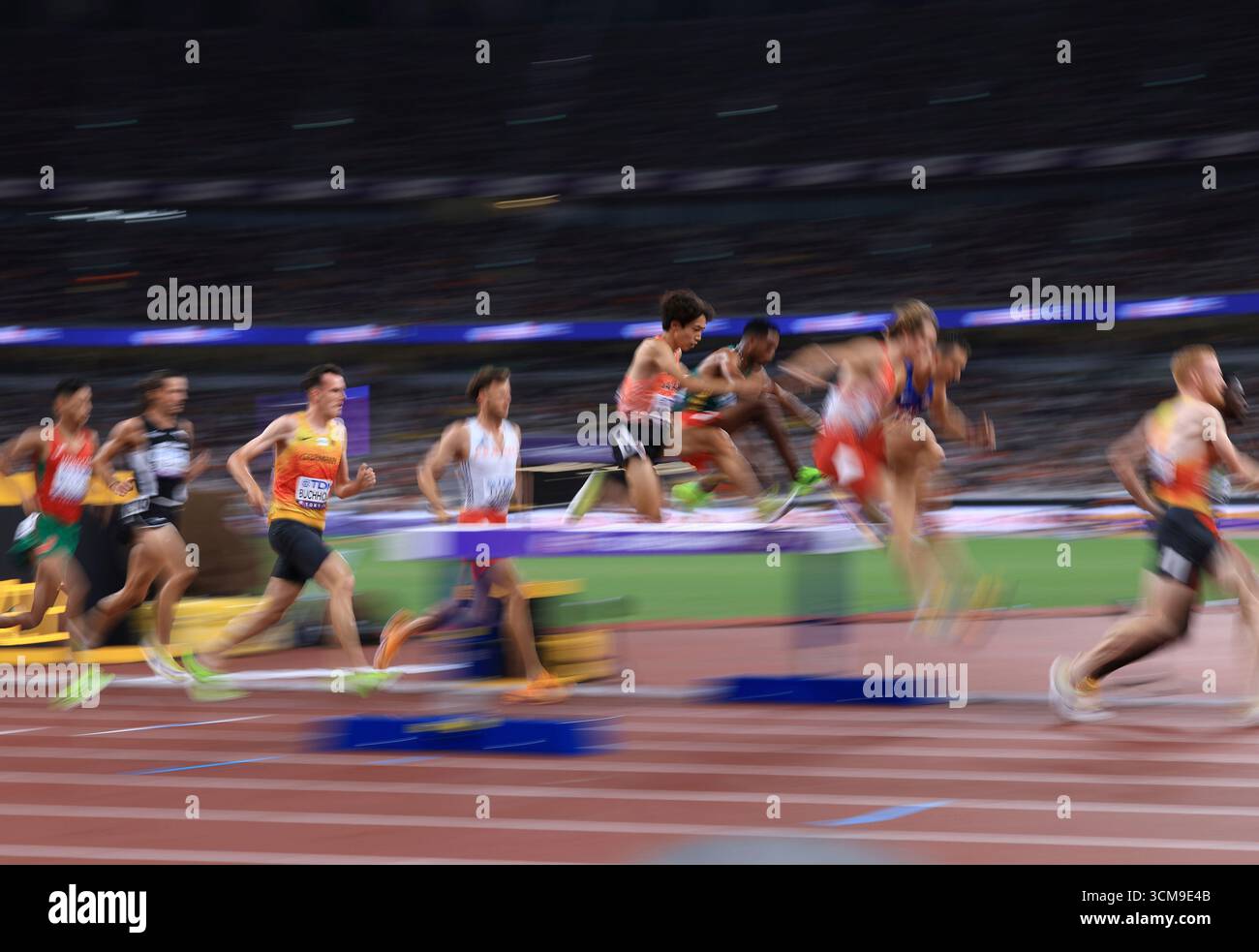 Athletes compete in the men's 3000 meters steeplechase final at the ...