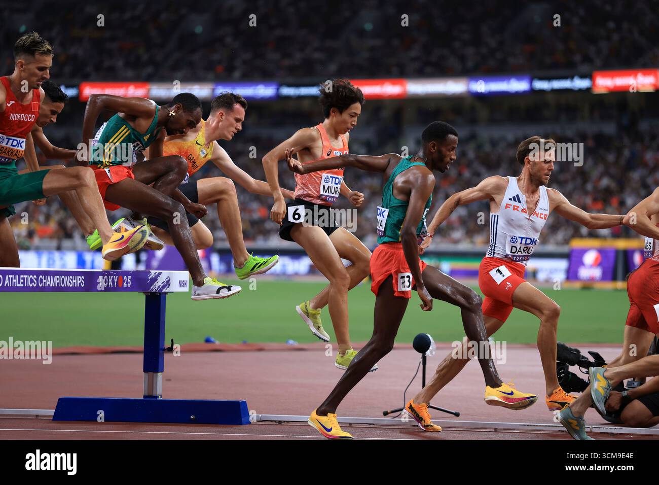 Athletes compete in the men's 3000 meters steeplechase final at the ...
