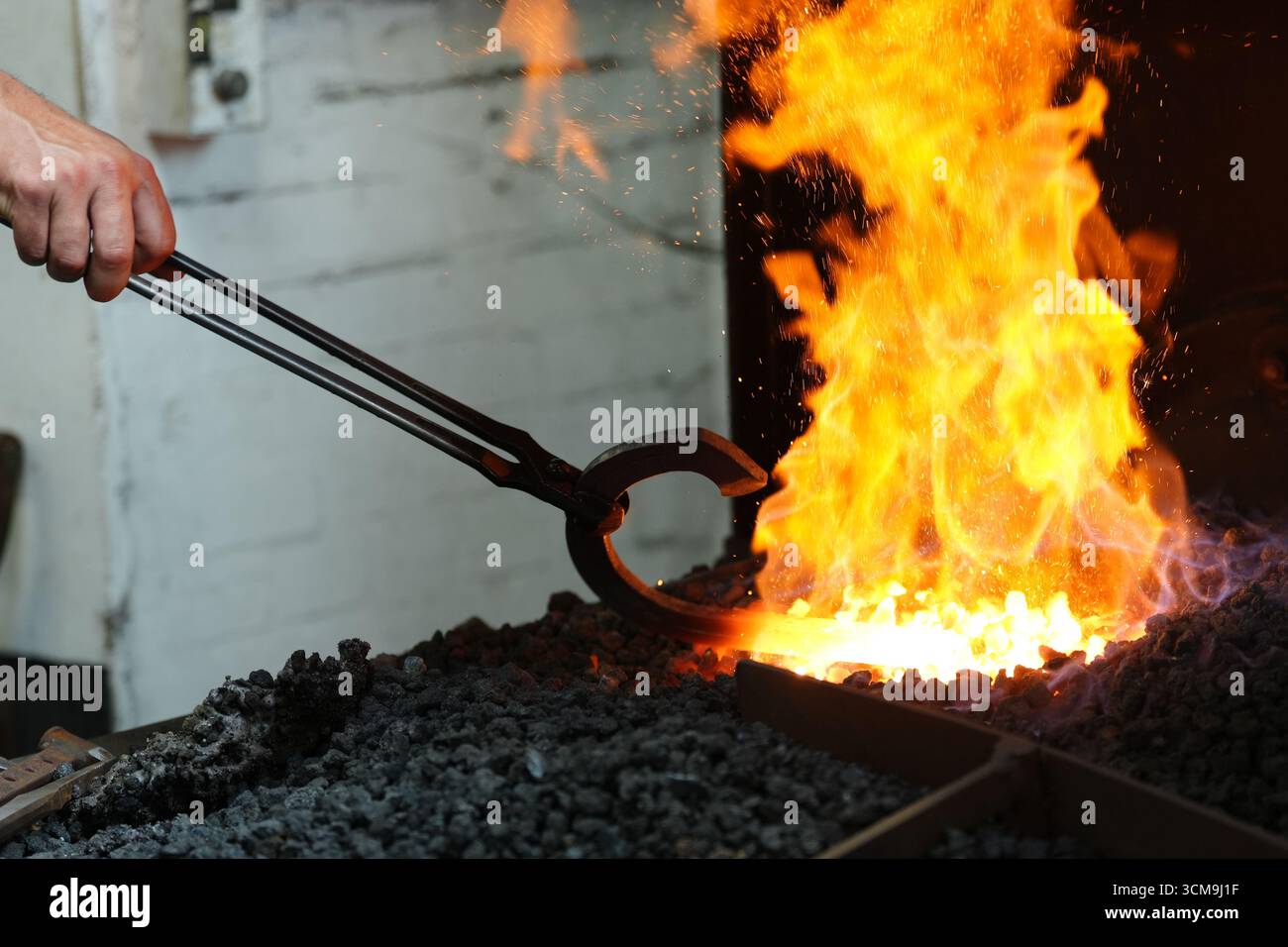 A British Army Farrier forges a horseshoe ahead of the State Visit of ...