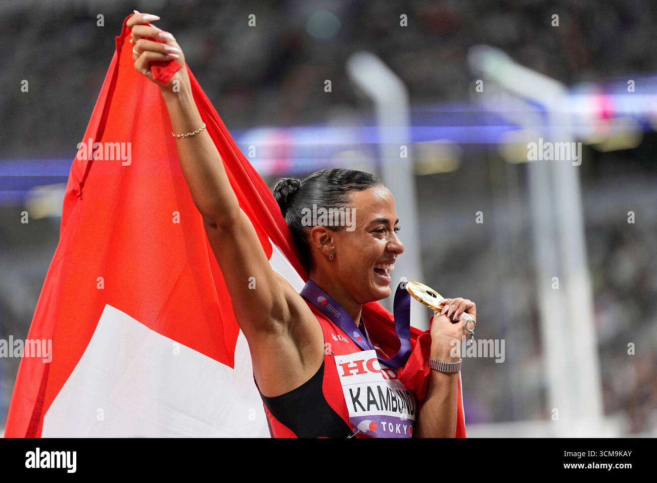 Switzerland's Ditaji Kambundji celebrates winning the gold medal in the ...