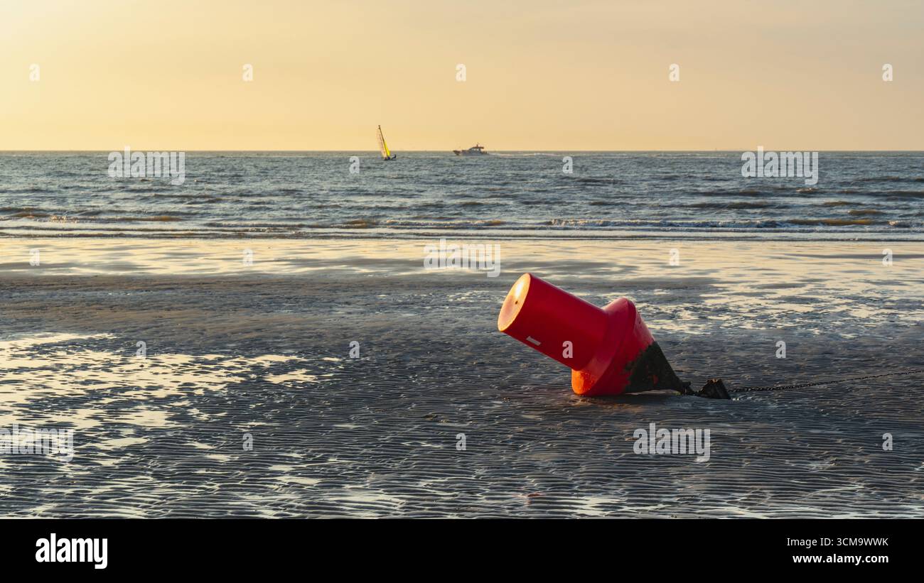 Yellow buoy on a chain on the beach hi-res stock photography and images ...