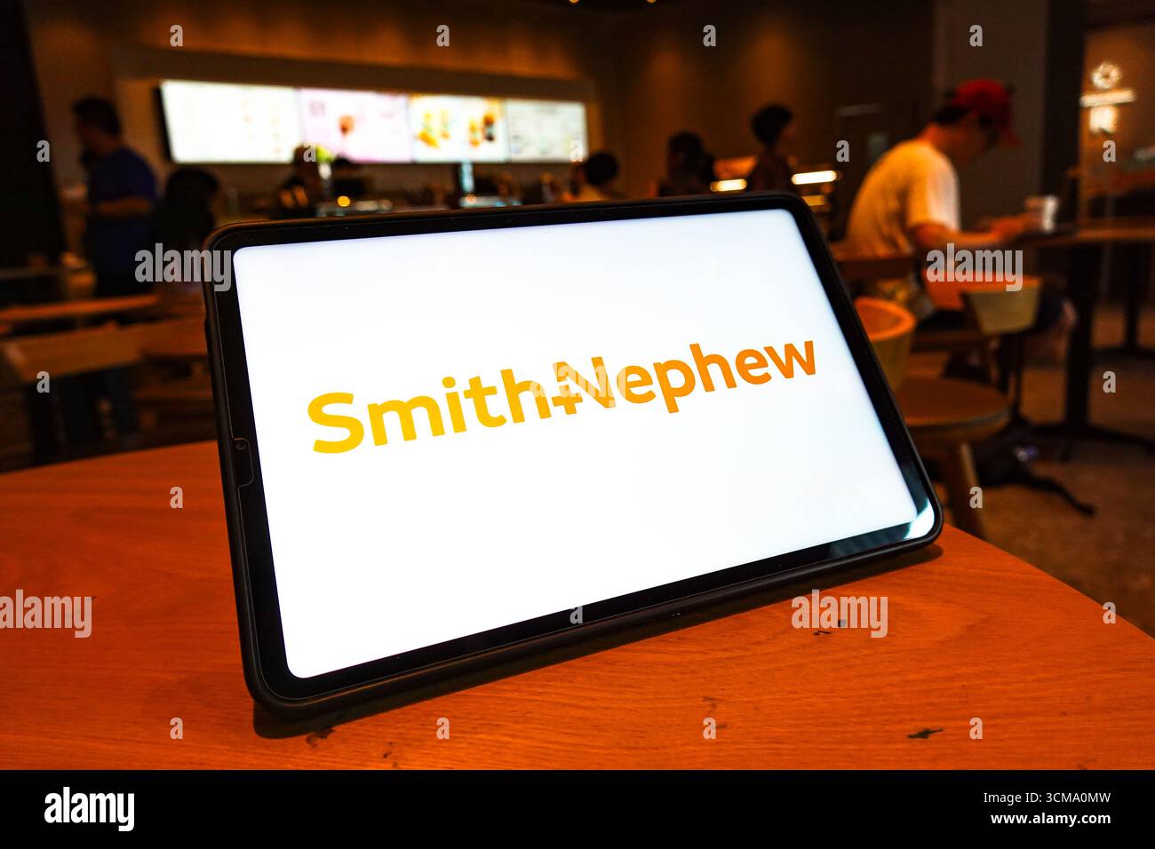In this photo illustration, the logo of Smith+Nephew is displayed on ...