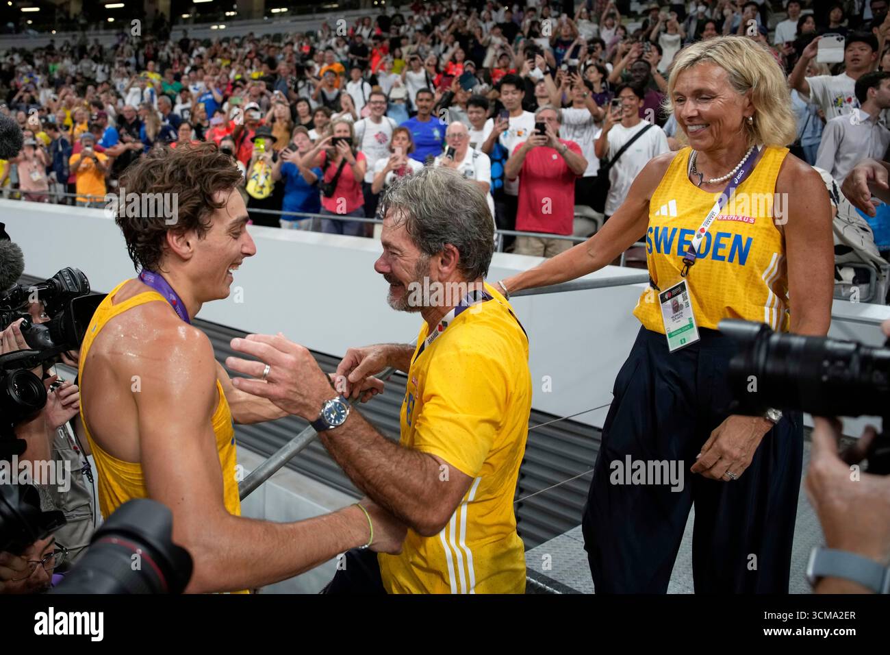 Sweden's Armand Duplantis celebrates with his parents after making a ...