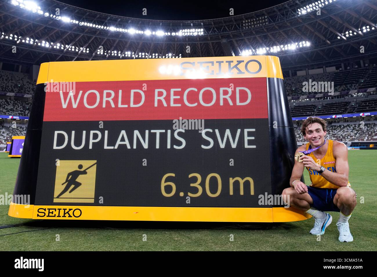 Sweden's Armand Duplantis poses after setting a new men's pole vault ...
