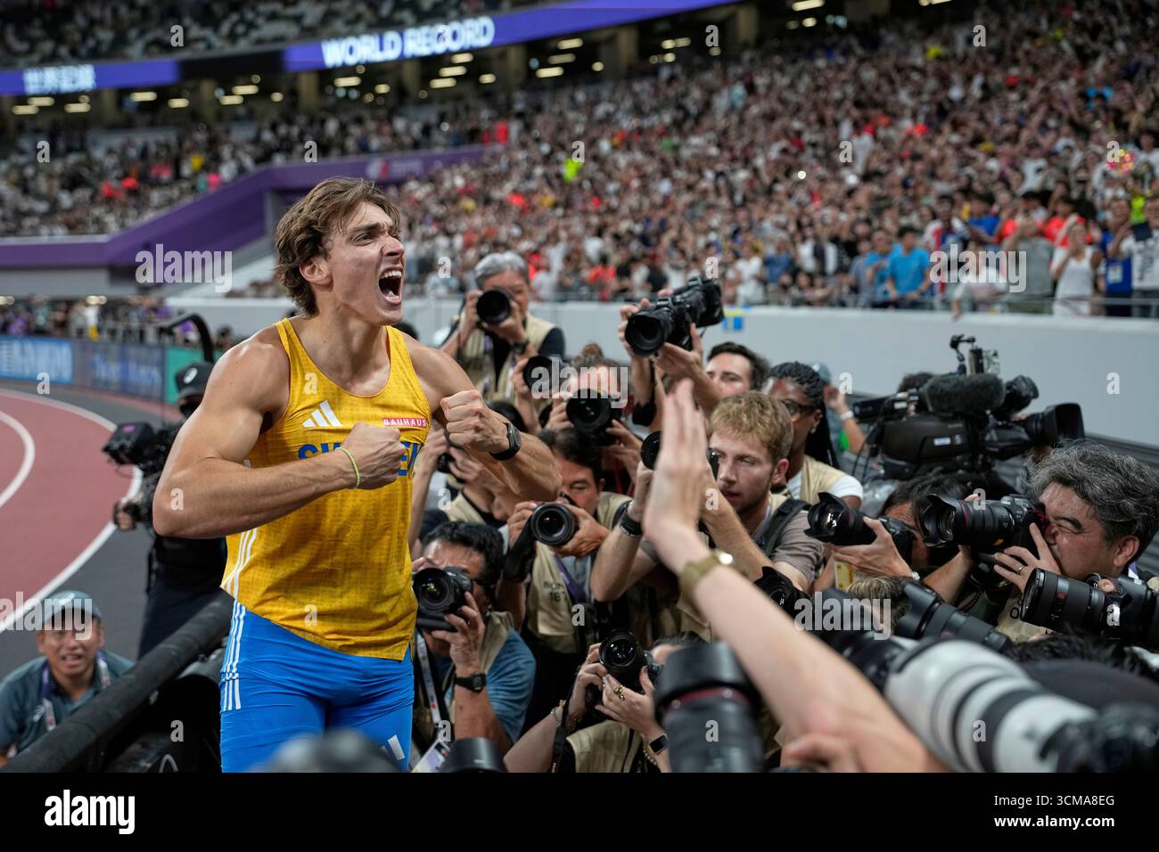 Sweden's Armand Duplantis celebrates after making a clearance to break ...